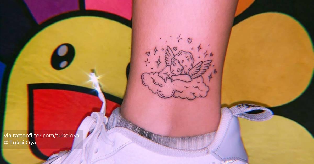 Fine line cherub tattoo on ankle