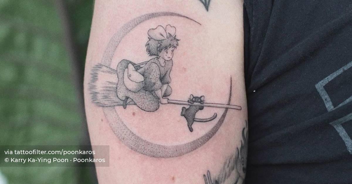Kiki and Jiji tattoo on upper arm
