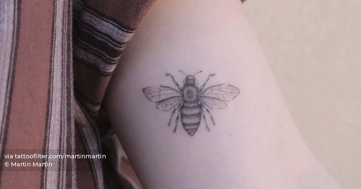 Bee tattoo on bicep