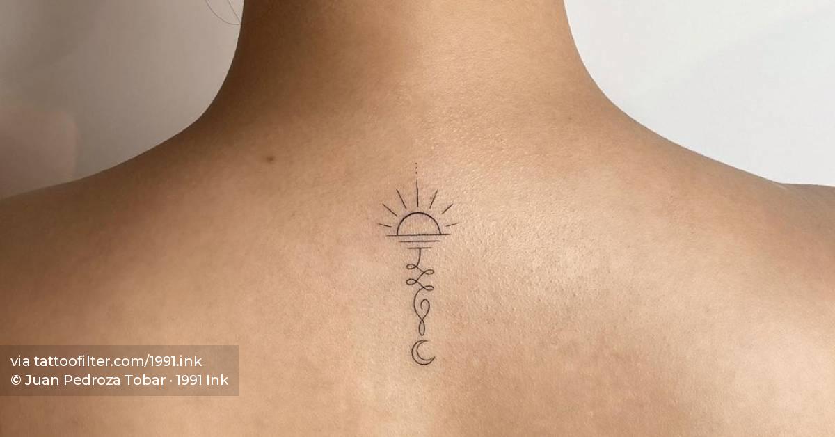 Sun and moon unalome tattoo on upper back