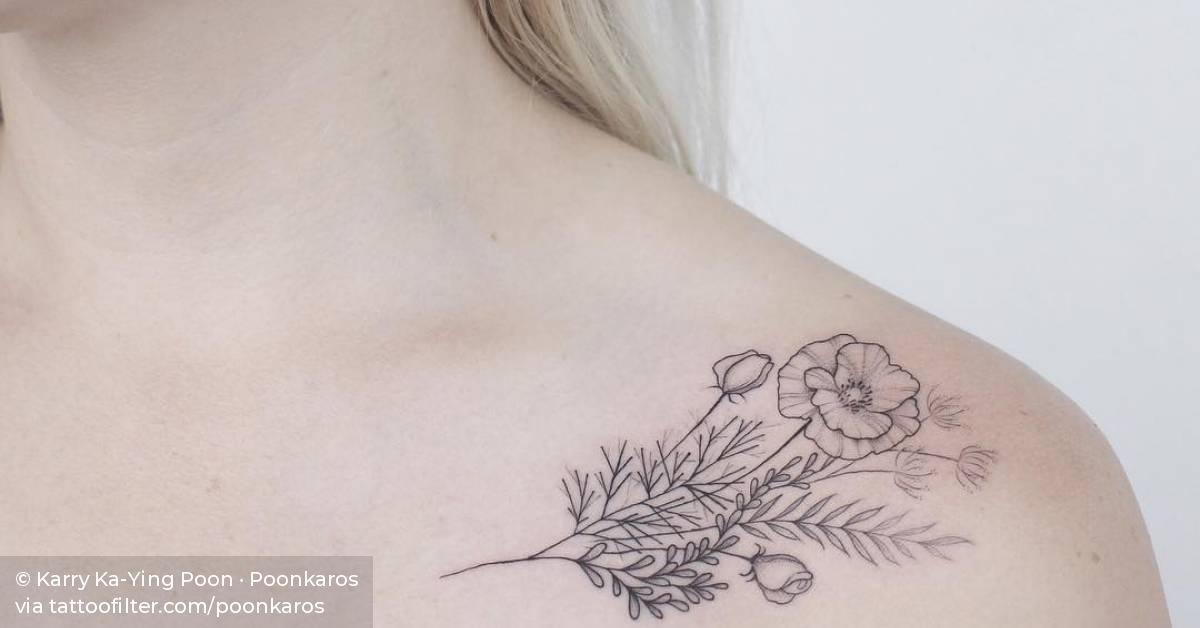 Illustrative tattoo on the left shoulder.