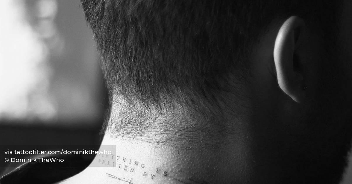 Lettering tattoo on the back of the neck