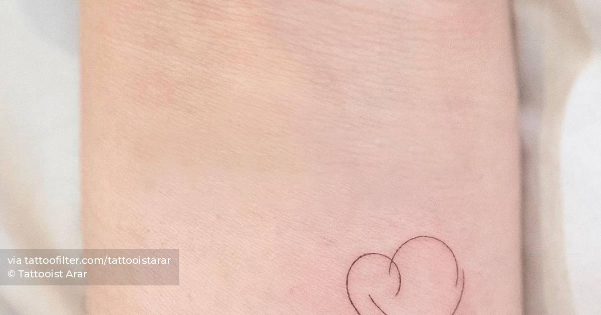 Fine line tiny heart tattoo