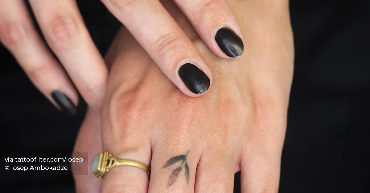 Delicate healed finger tattoo