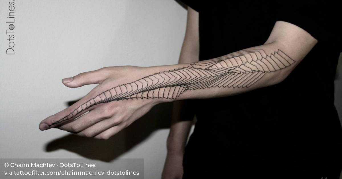 Line art style geometric piece on the left arm.