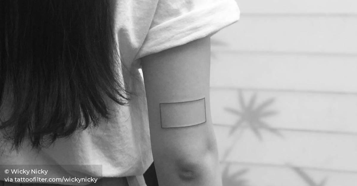 Minimalist rectangle tattoo on the back of the right
