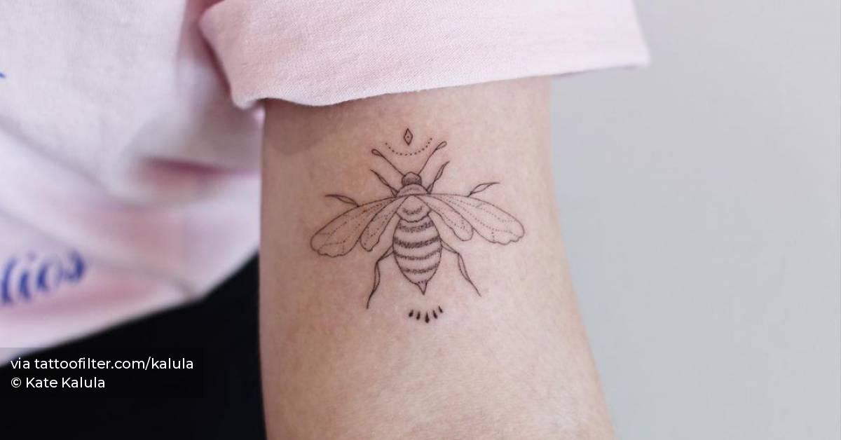 Hand poked bee tattoo on bicep