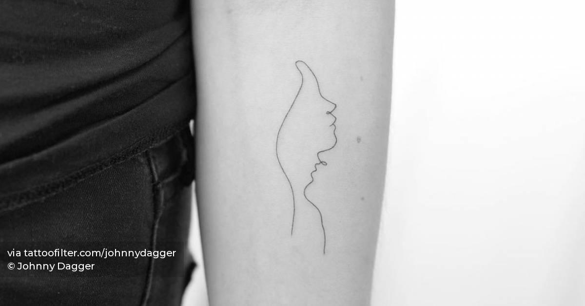 two join together to make one - faces tattooed in one