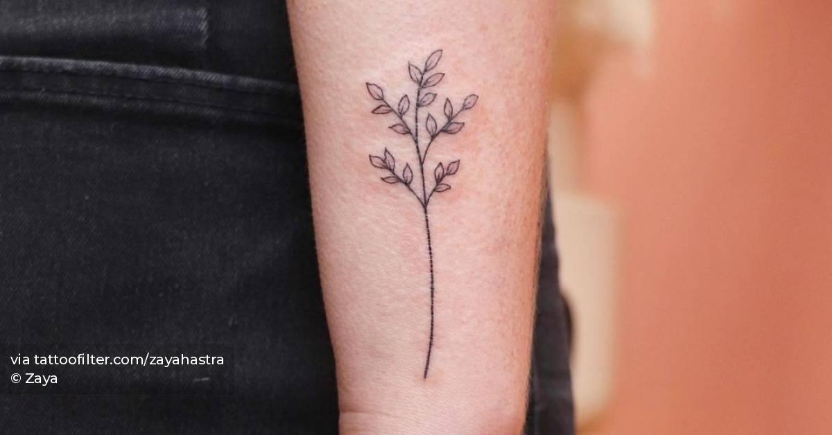 Fine line branch tattoo on the wrist