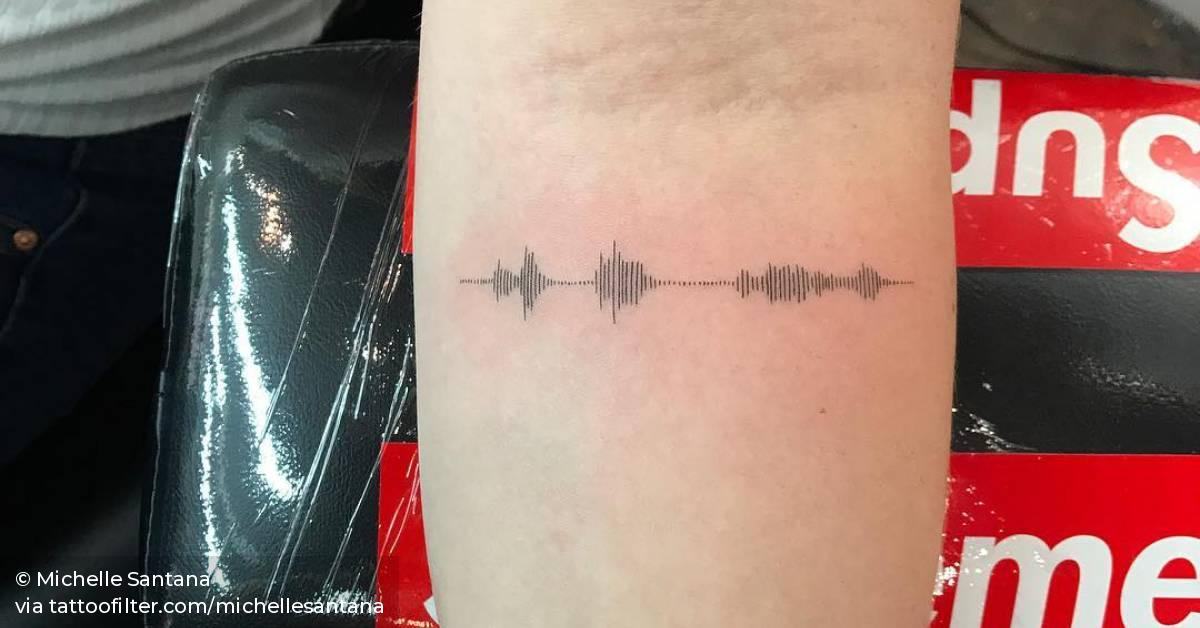 Soundwave tattoo on the inner forearm.