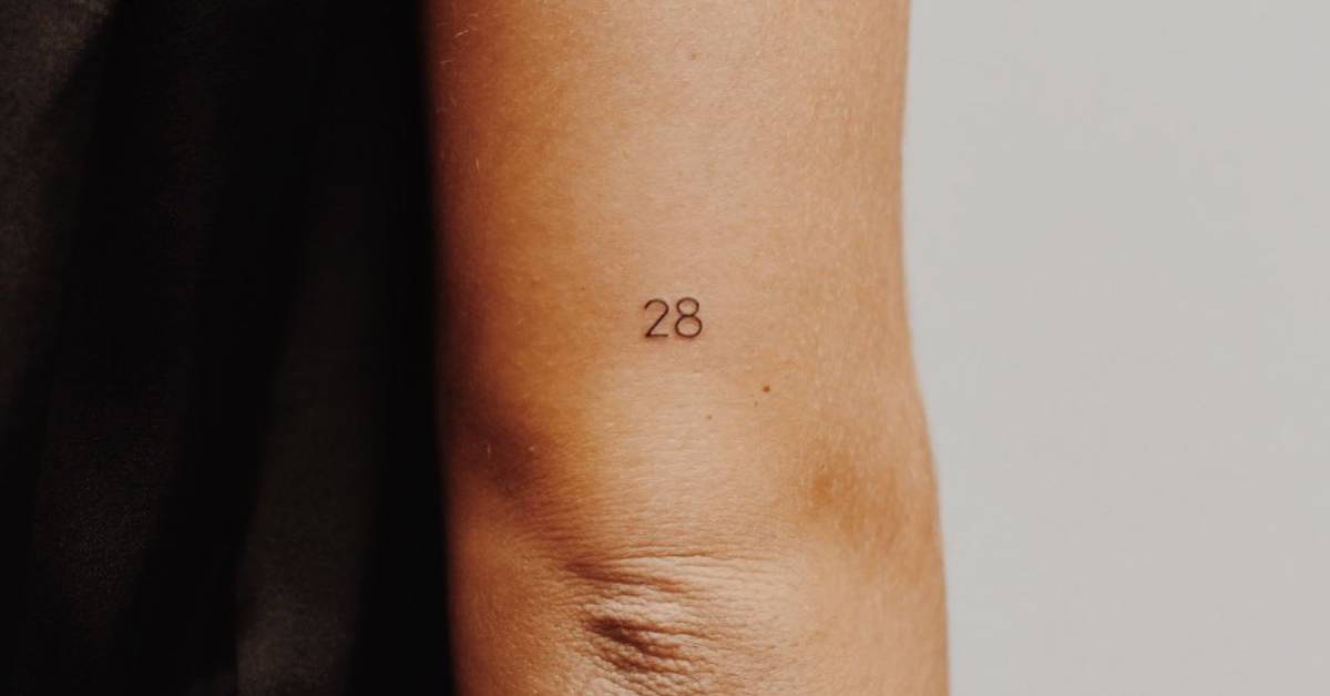"28" tattooed on the tricep