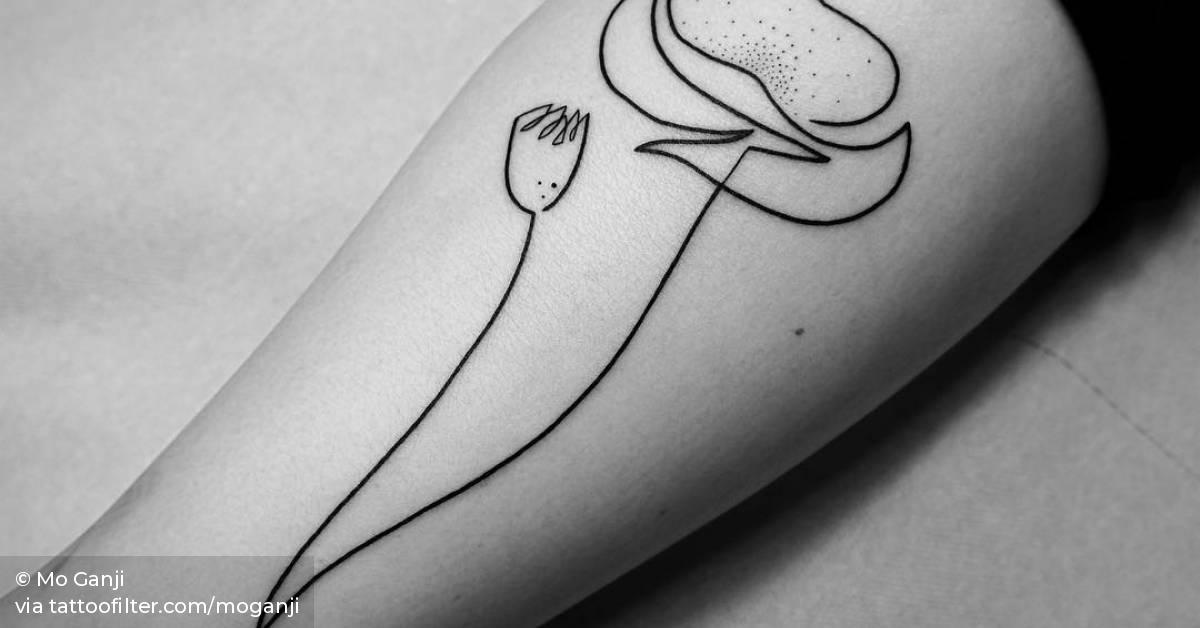 Continuous line poppy tattoo on the calf.