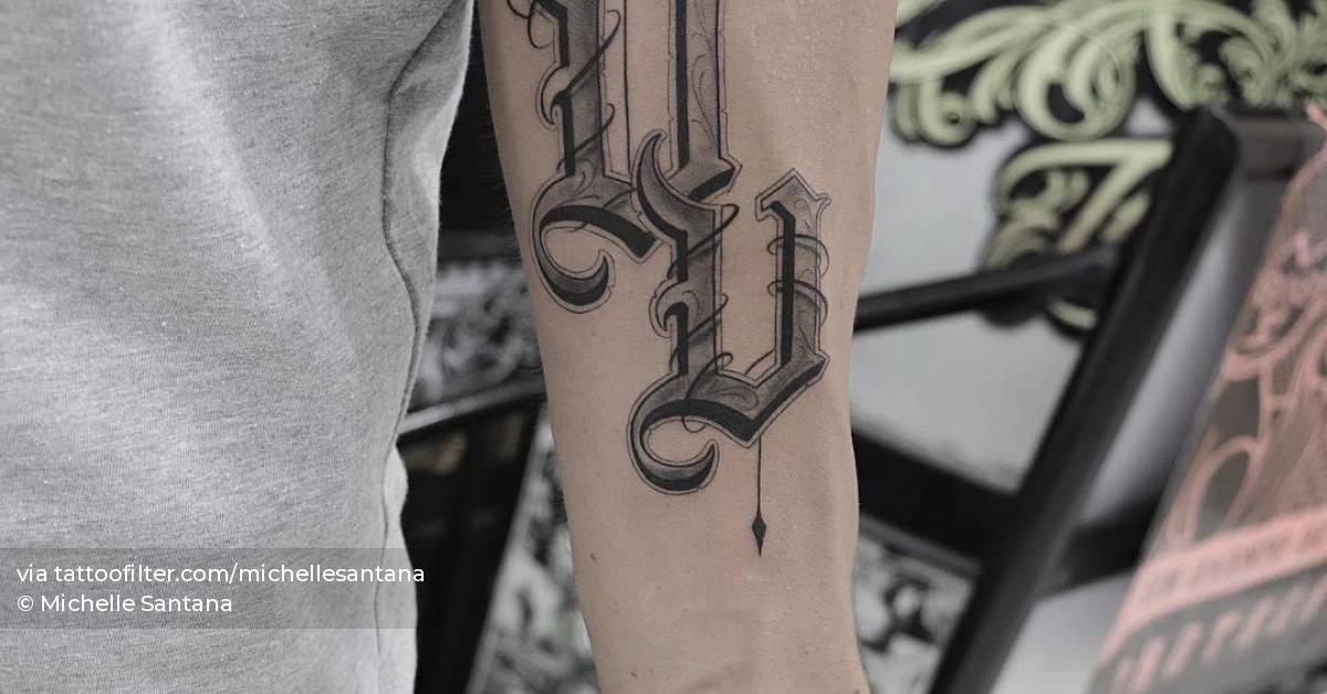 "V" "V" lettering tattoo on the inner forearm