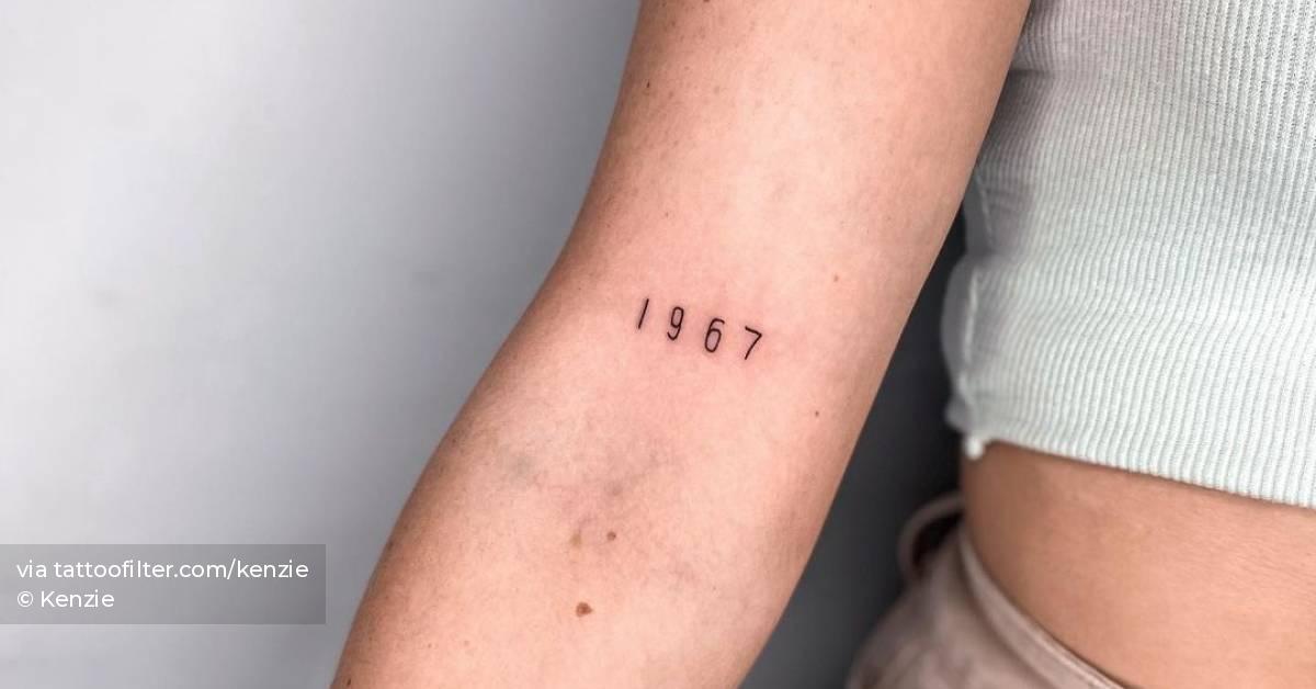 "1967" tattooed on the bicep