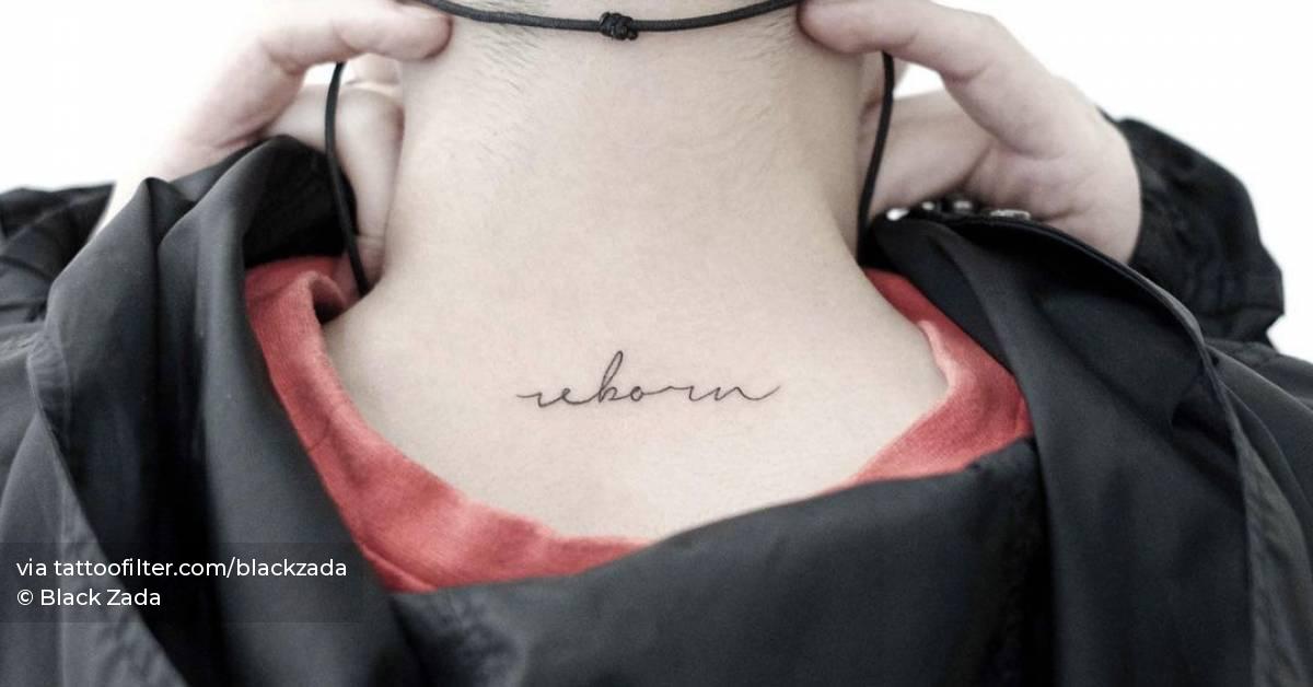 "Reborn" lettering tattoo on the back of the neck