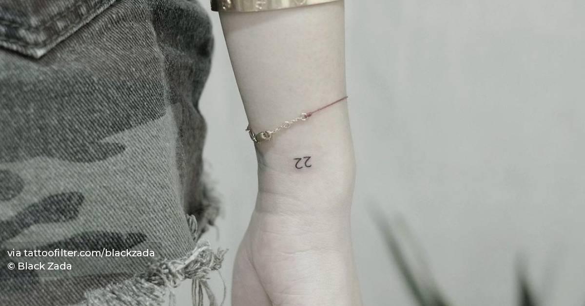 "22" tattooed on the wrist