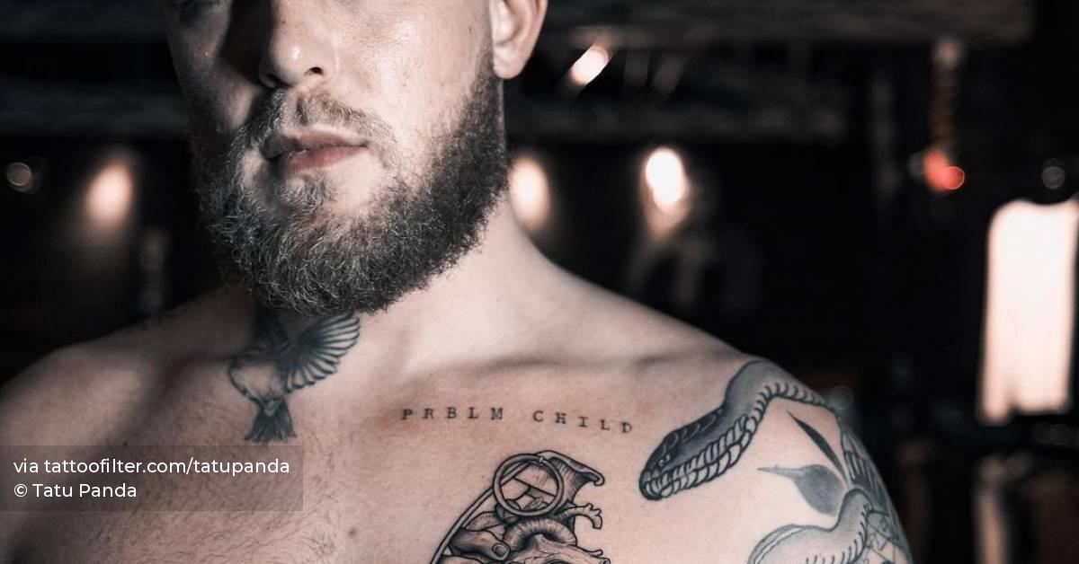 Hand holding a heart shaped grenade tattooed on Jake