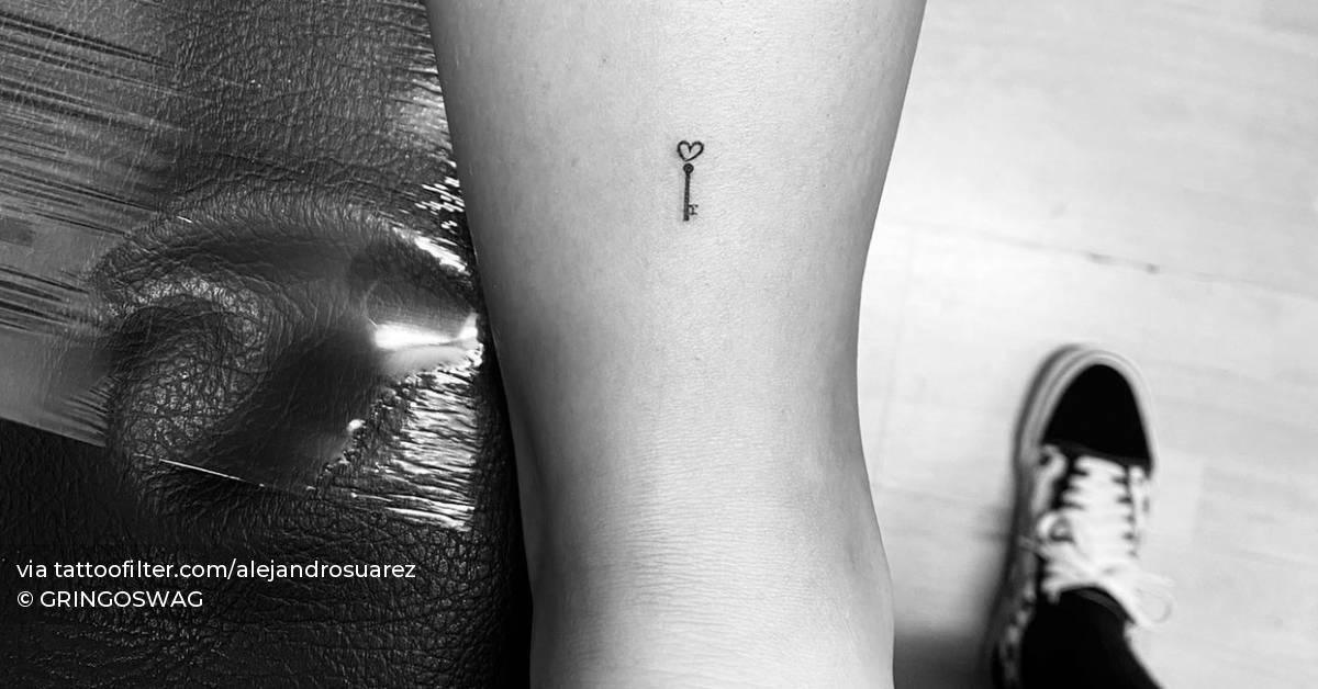 Tiny key tattoo