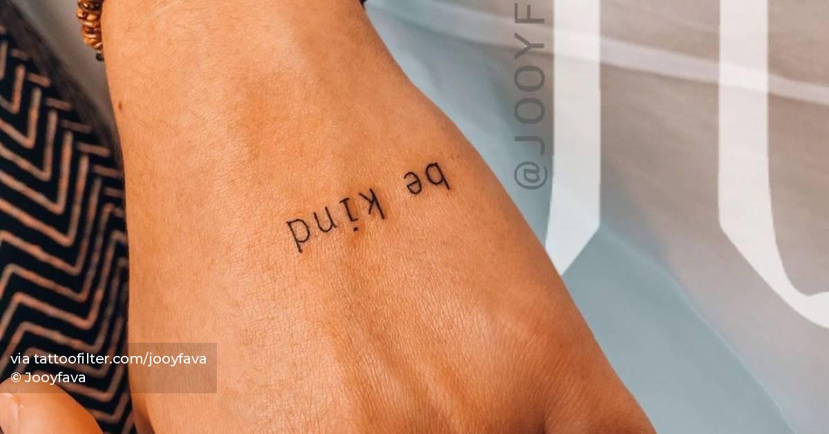 "Be kind" lettering tattoo on the hand