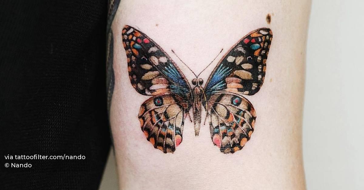 Micro-realistic butterfly tattoo on the bicep