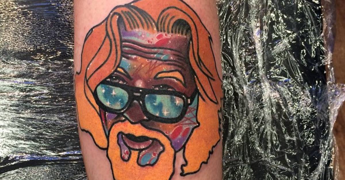 The Big Lebowski portrait tattoo on the right calf.