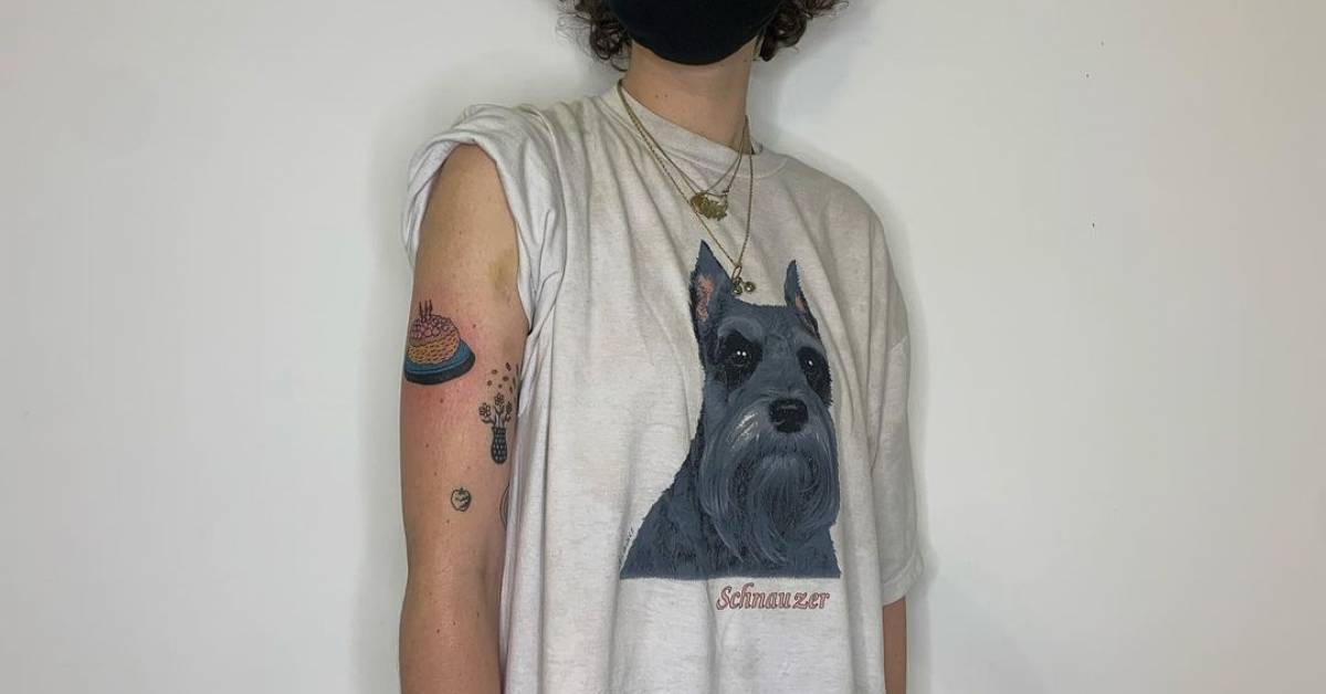 Cake tattoo on Ella Emhoff's upper arm