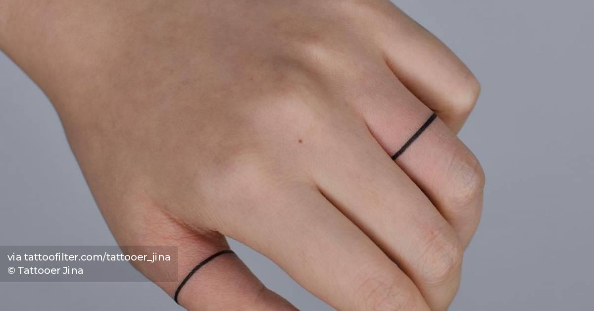 Line art ring tattoo on the finger