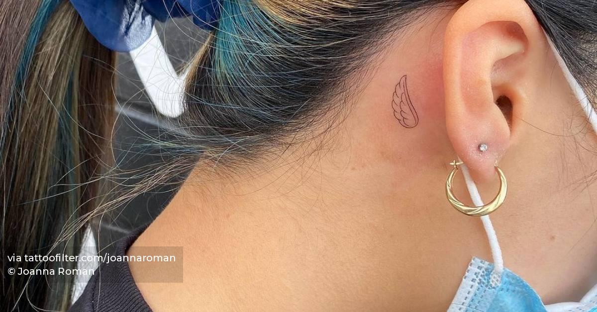 Fine line wing tattoo behind the ear