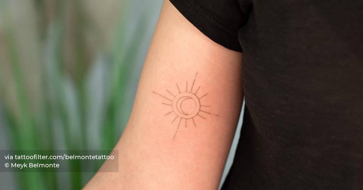 Fine line sun and moon tattoo on the bicep