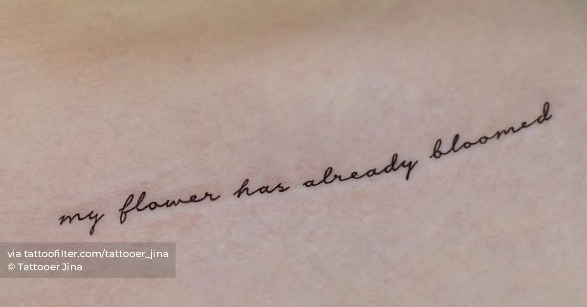"My flower has already bloomed" lettering tattoo
