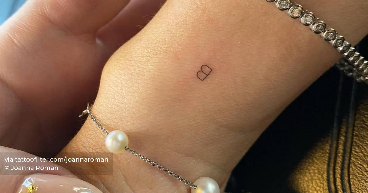 Letter "B" tattooed on the wrist