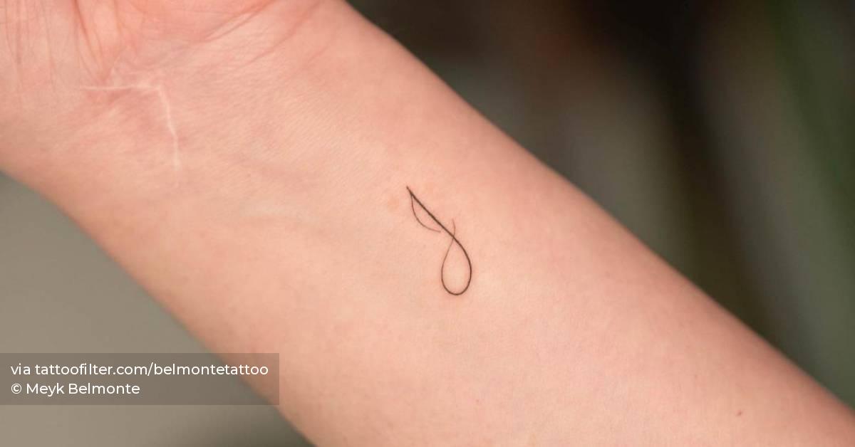 Letter "J" tattooed on the wrist