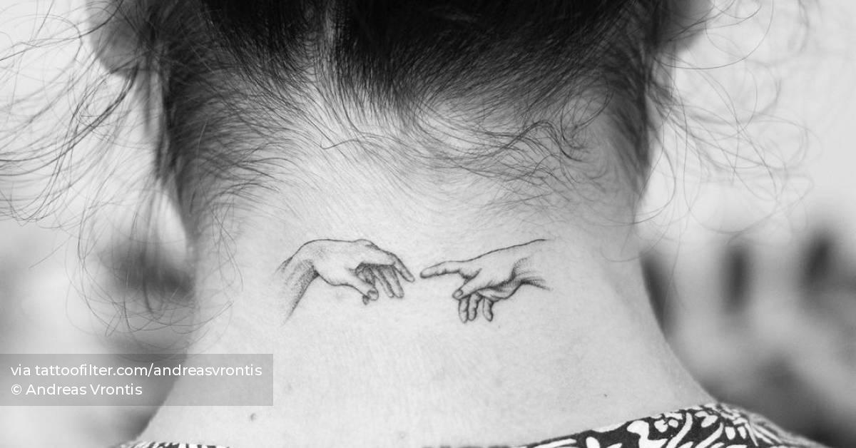 Hands from The Creation of Adam tattooed on the back of
