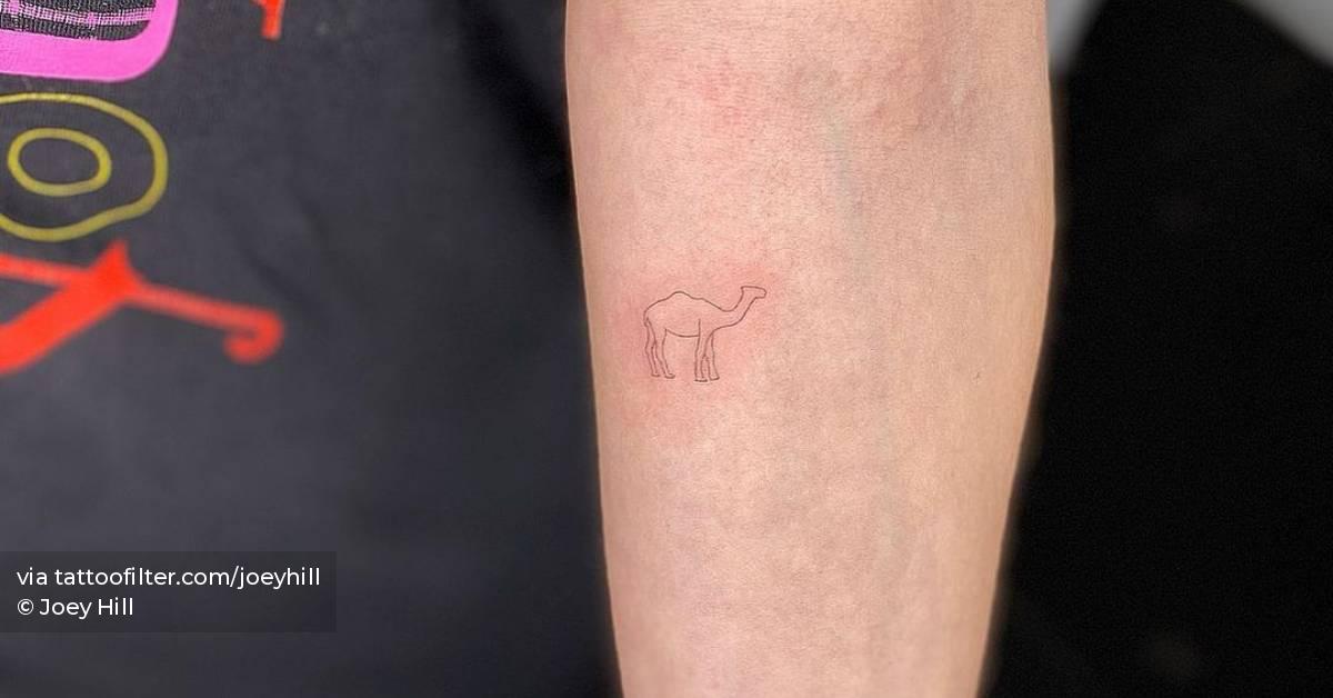 Fine line camel tattoo on the inner forearm