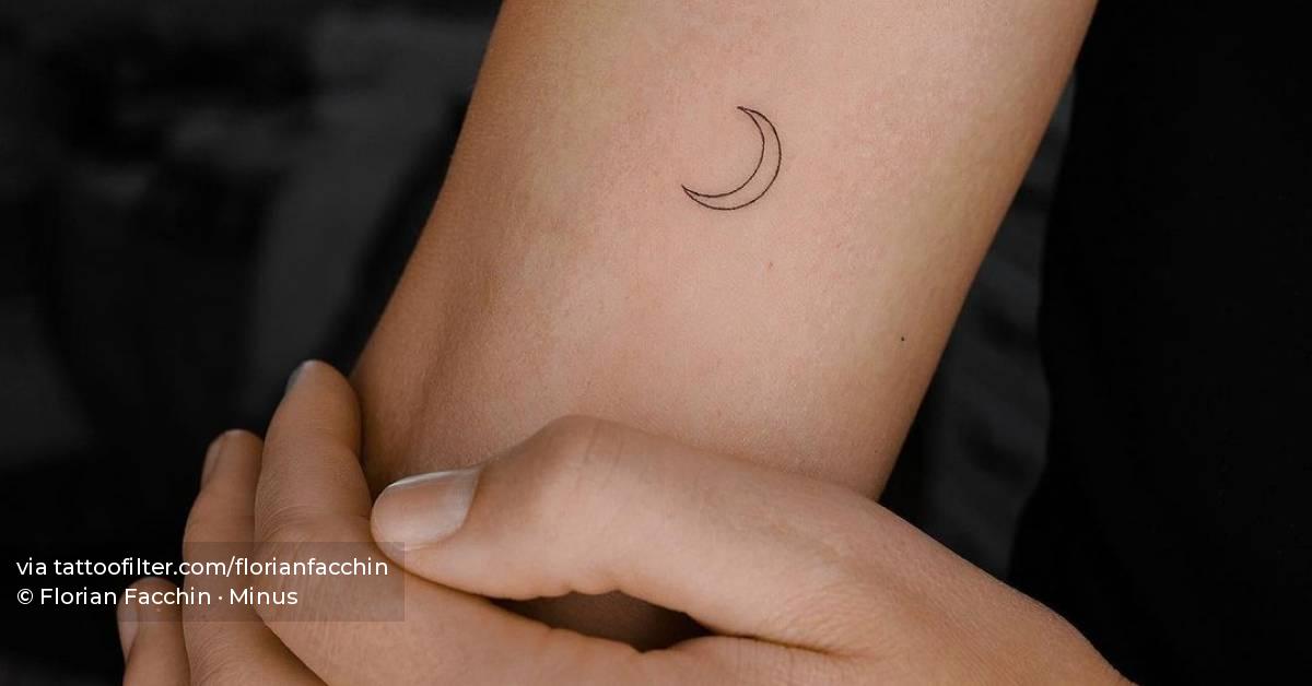 Fine line crescent moon tattoo on the inner arm
