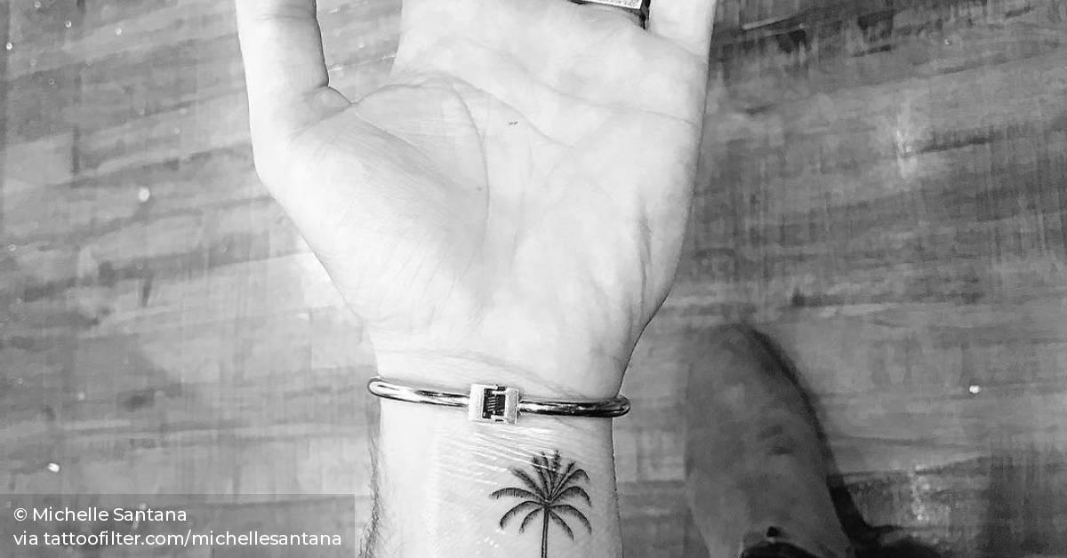 Palm tree tattoo on Jake Miller's wrist.