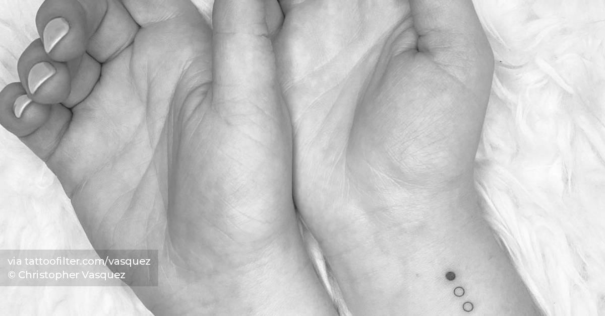 Minimalist matching tattoo for sisters