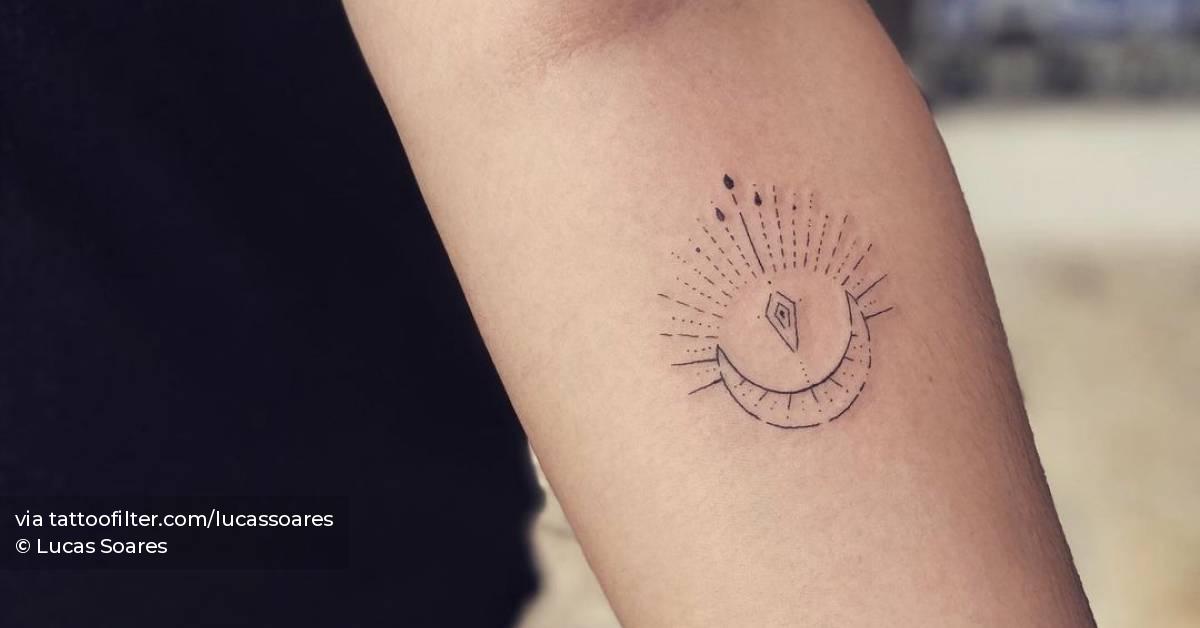 Fine line ornamental crescent moon tattoo