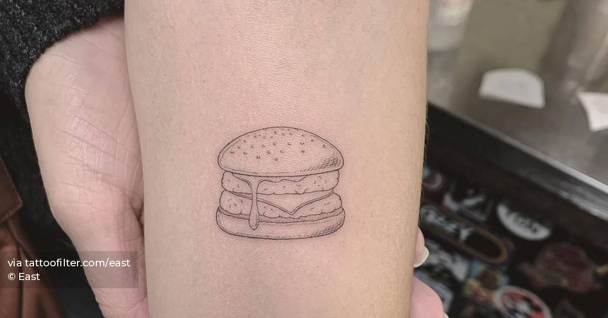Single needle burger tattoo on the inner forearm