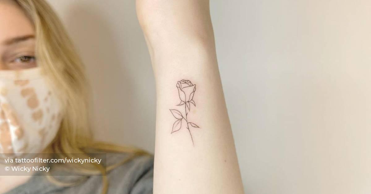 Fine line rose tattoo on the wrist