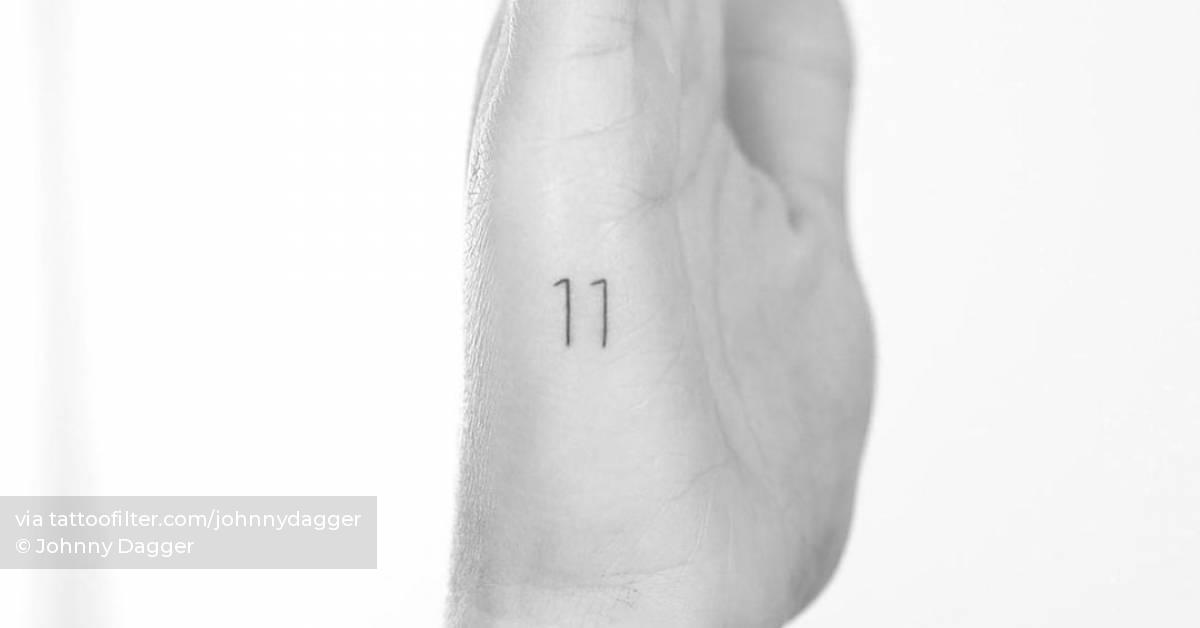 Number "11" tattoo on the hand