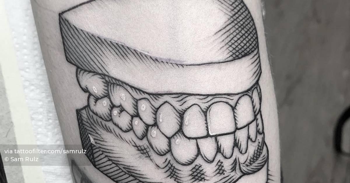 Teeth tattooo on the inner arm