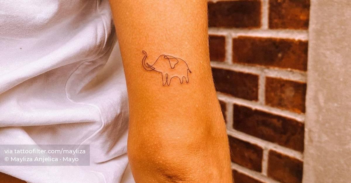 Minimalist one line elephant tattoo on the tricep
