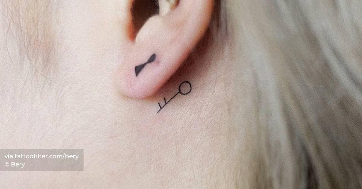 Minimalist keyhole and key tattoo