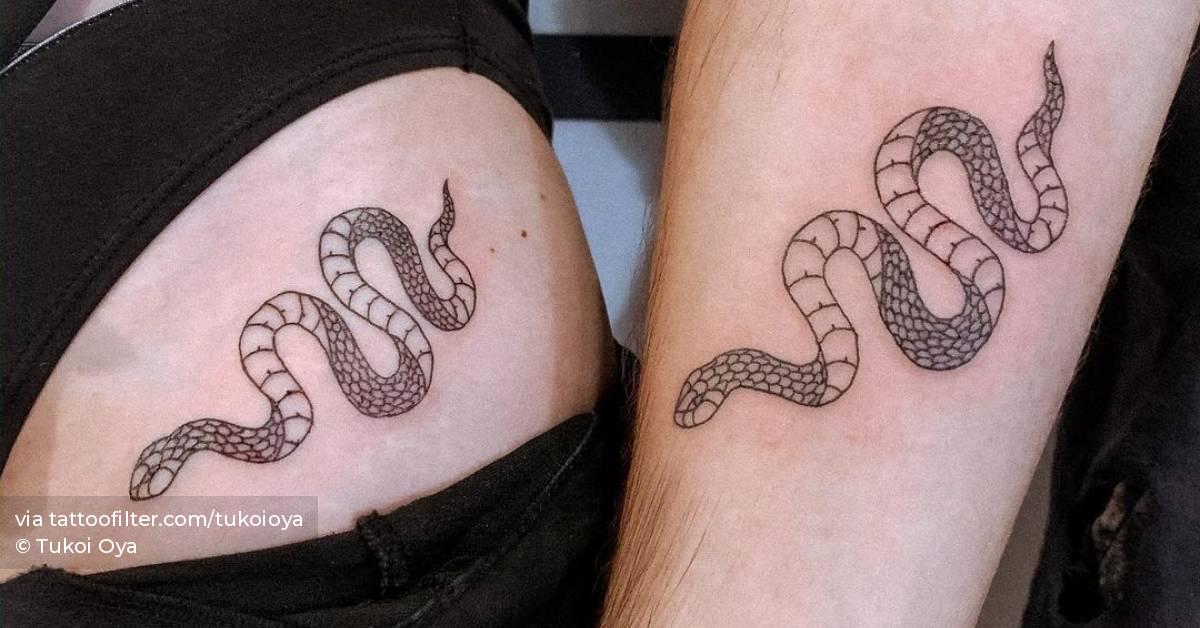 Fine line matching snake tattoo for couples