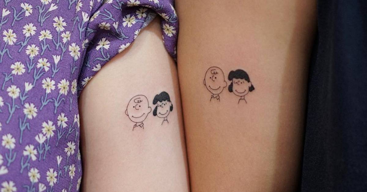 Peanuts characters matching tattoos for couple.