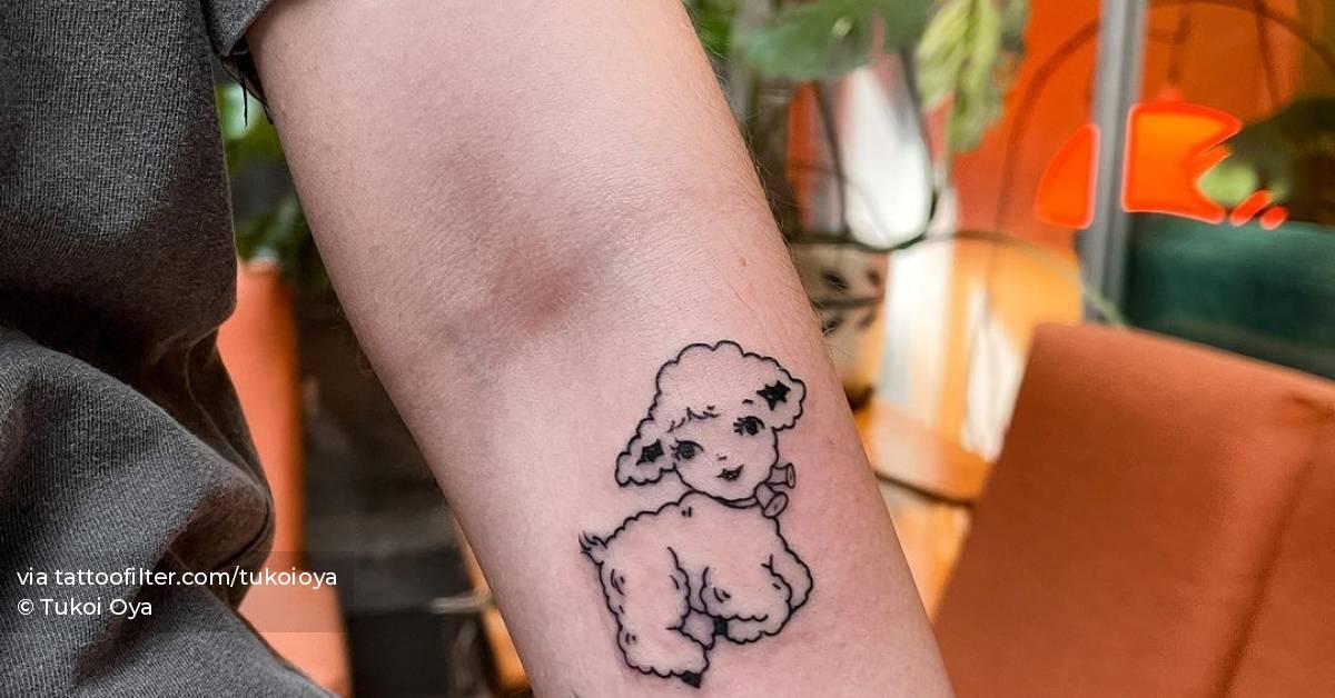 Fine line lamb tattoo on the forearm.