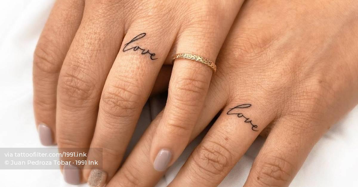 "Love" matching lettering tattoo for couples.