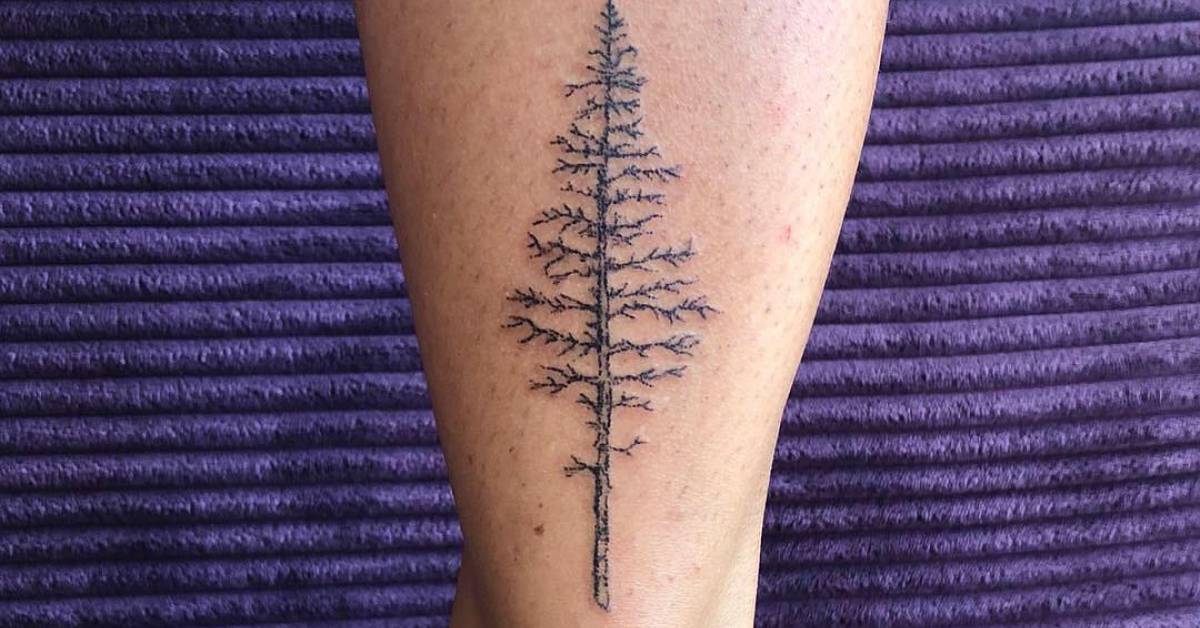 Hand poked pine tree tattoo on the achilles.