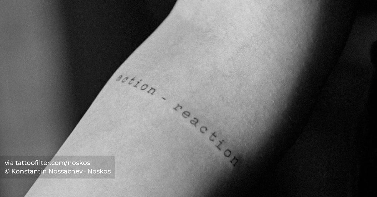 "Action - reaction" lettering tattoo on the inner